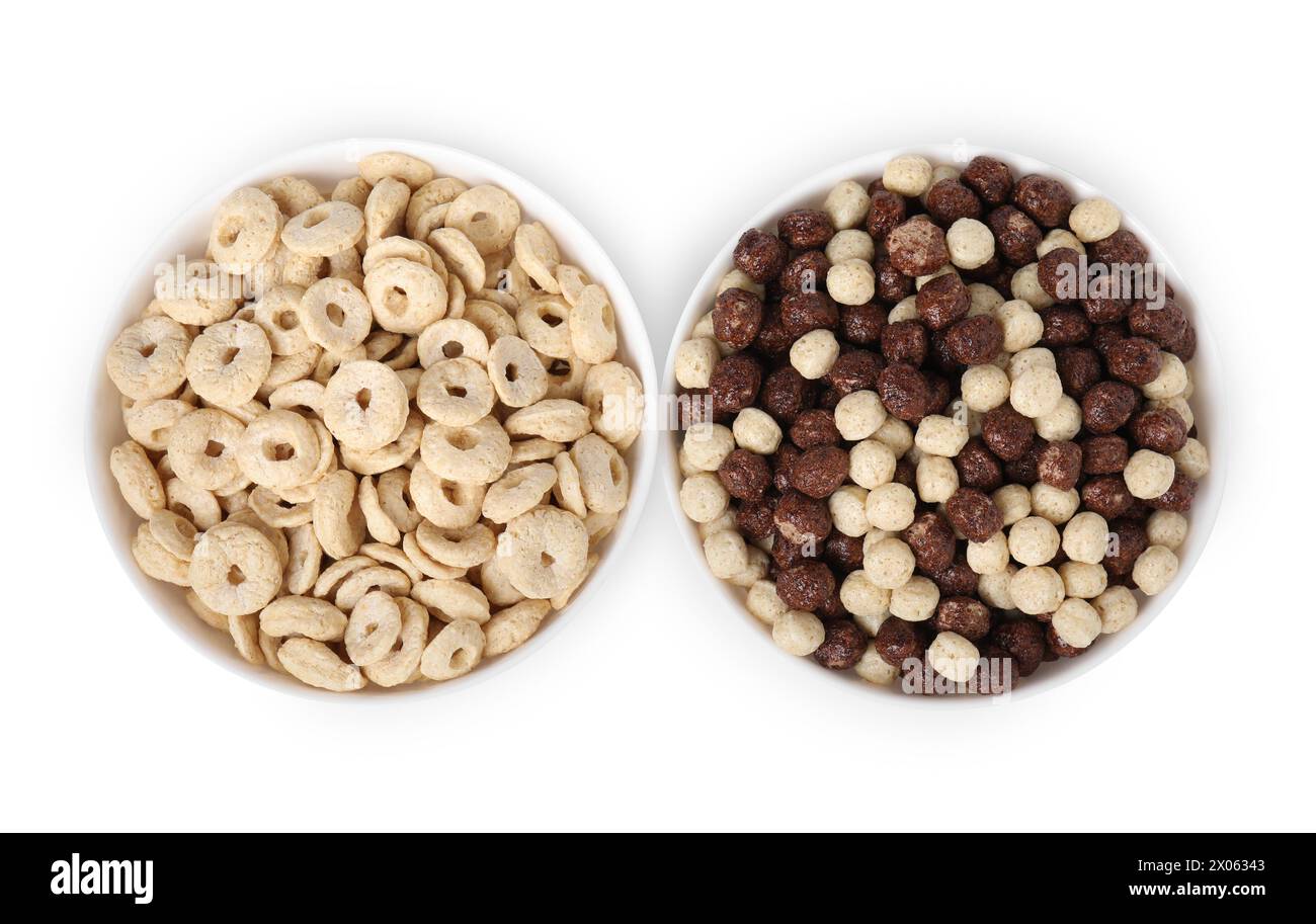 Different types of breakfast cereals in bowls isolated on white, top ...
