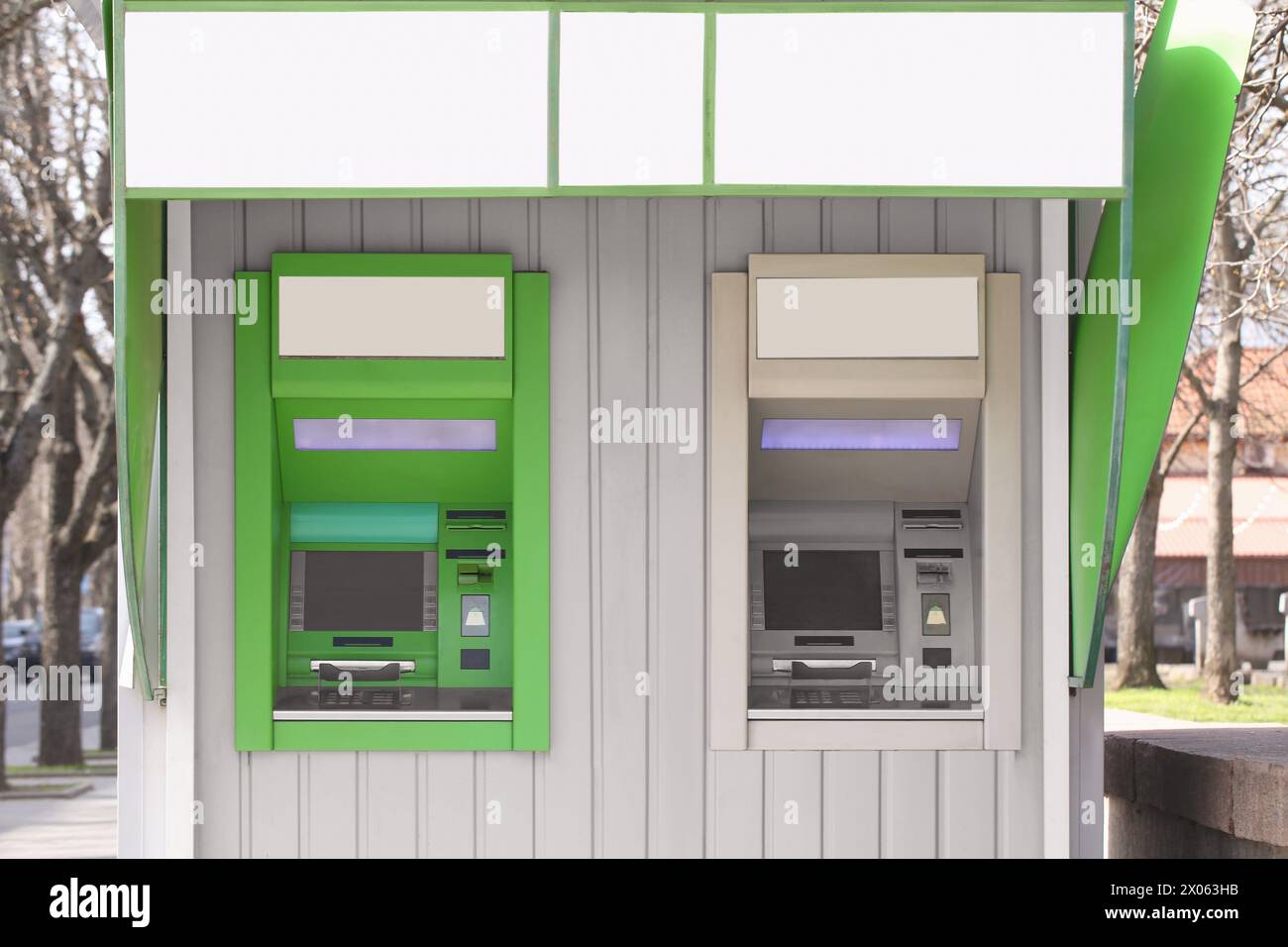 Modern automated cash machines with screens outdoors Stock Photo - Alamy