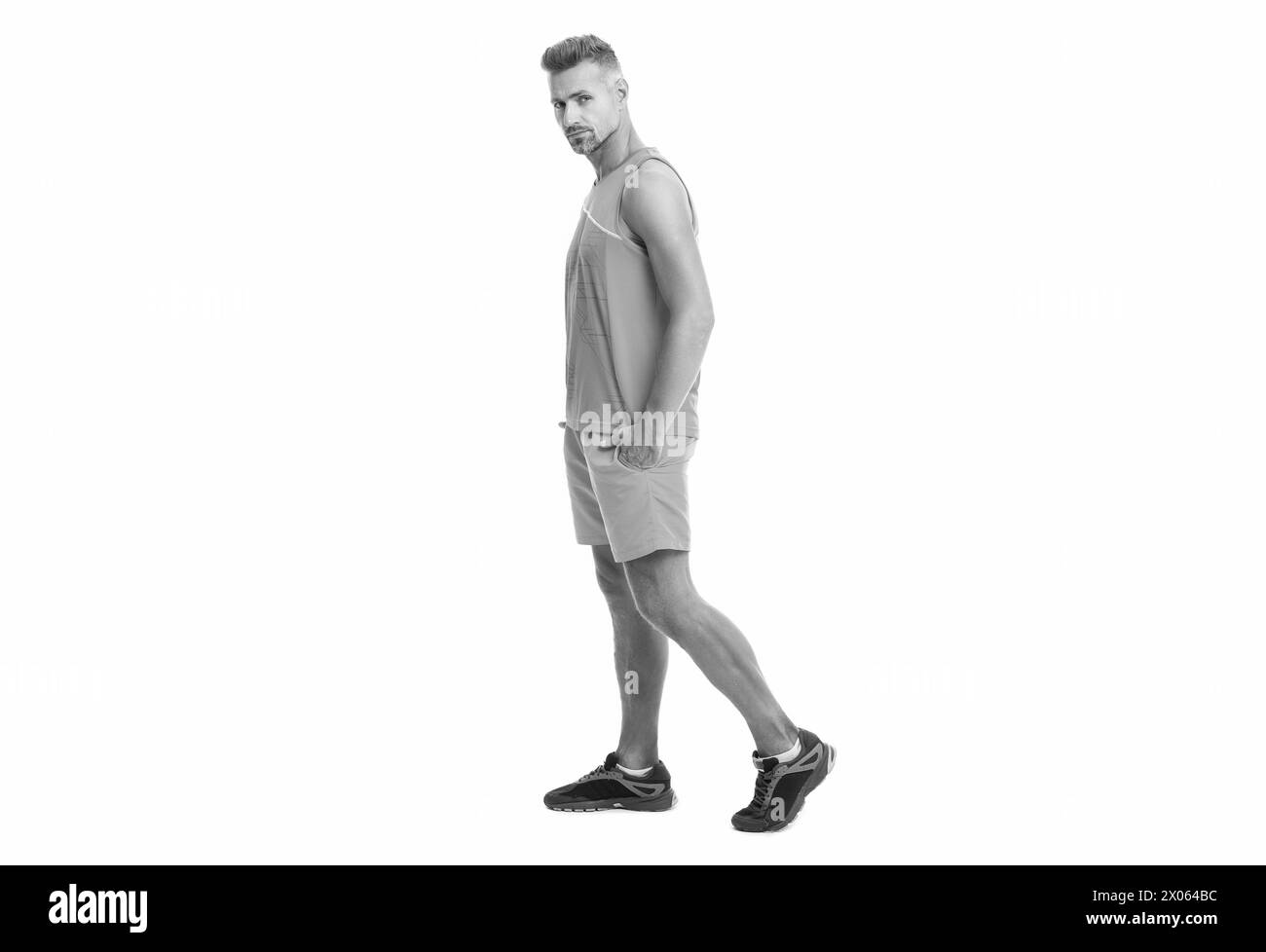 confident athlete wears sport wear standing alone. The male sport ...