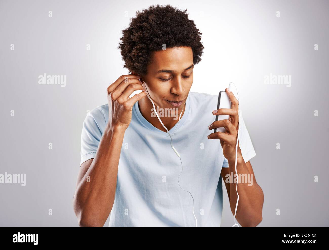 Black man, listening to music and cellphone with sound, radio and live ...