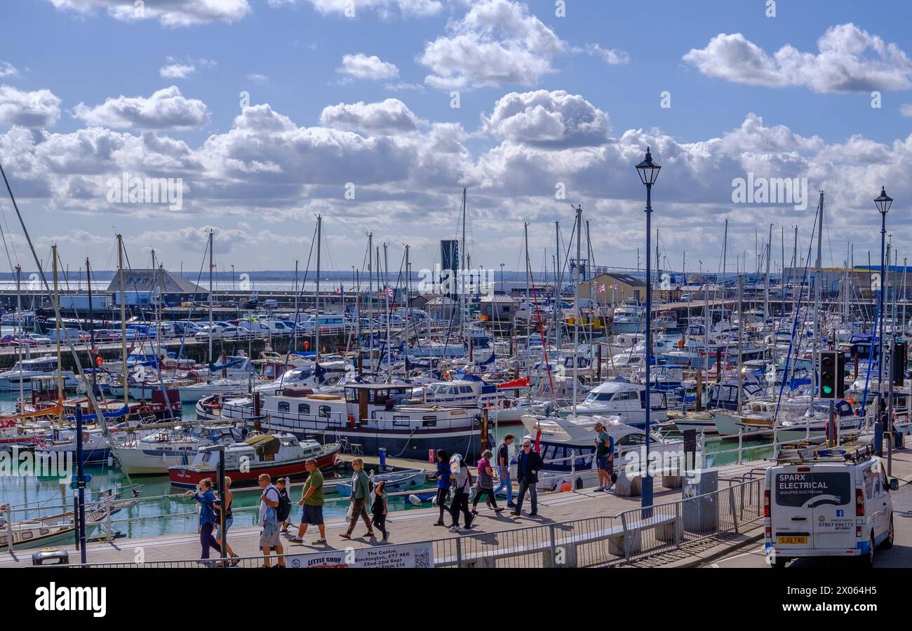 Ramsgate Royal Harbour filled with various boats and yachts, under a ...