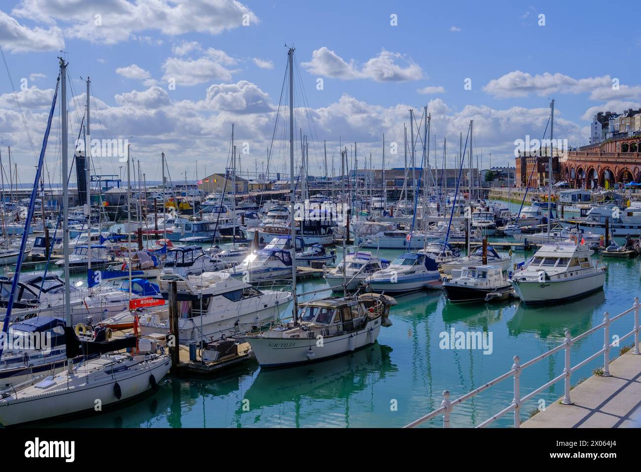 Ramsgate Royal Harbour filled with various boats and yachts, under a ...