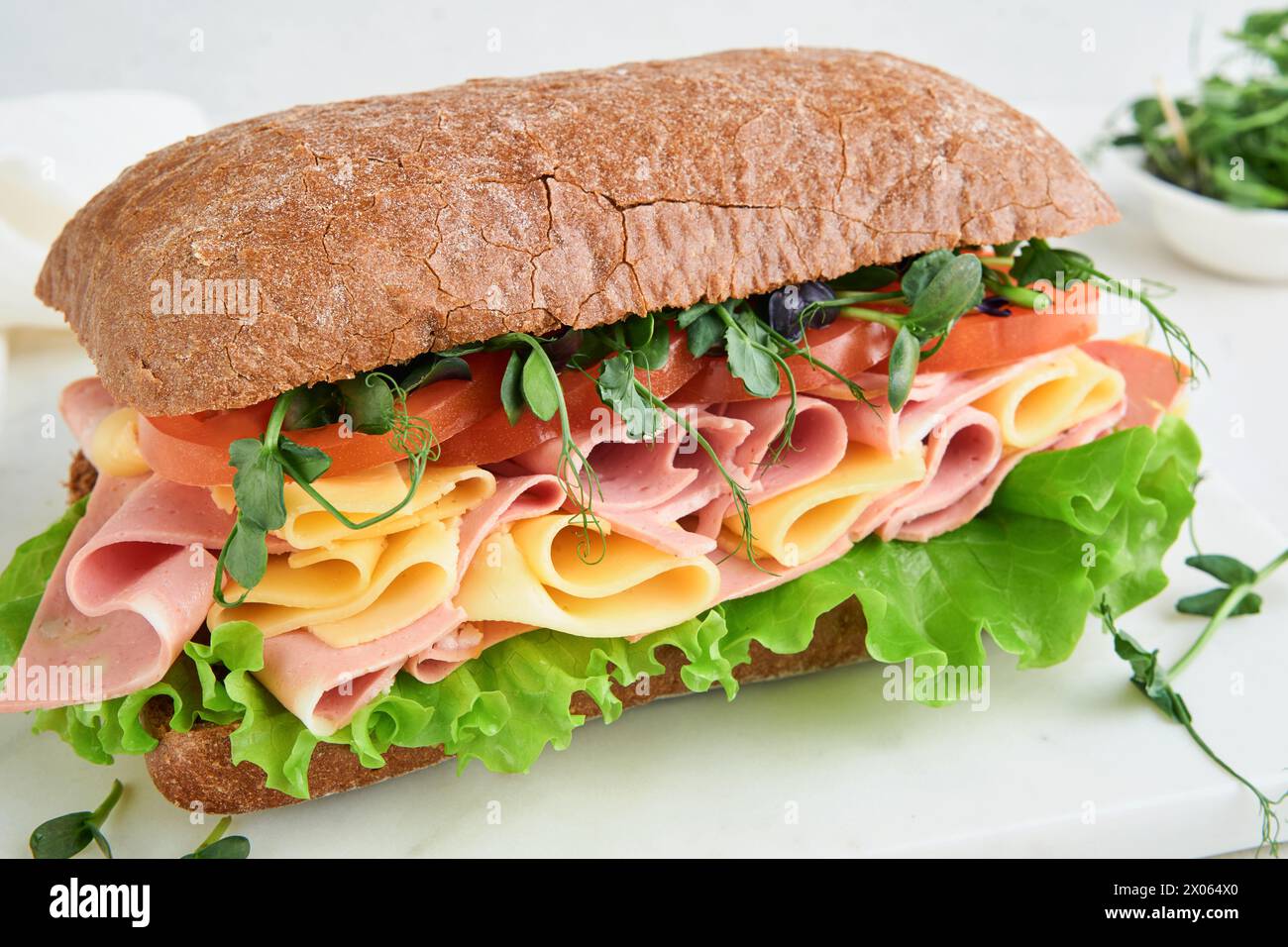 Sandwich. One fresh big submarine sandwich with ham, cheese, lettuce ...