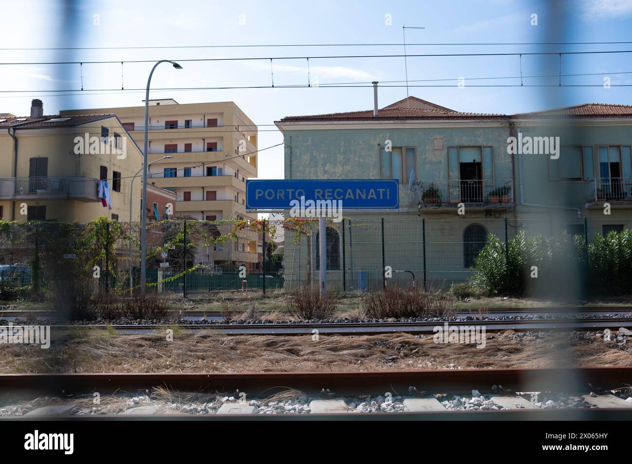 The railway passing through the Italian city of Porto Recanati. Blue ...