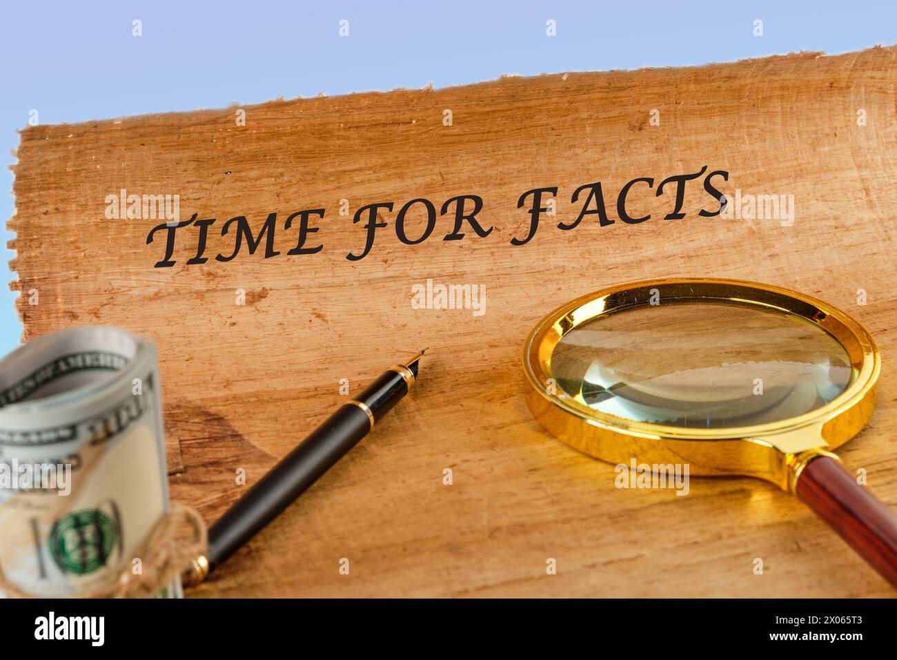 Time for facts message written on papyrus next to a magnifying glass ...