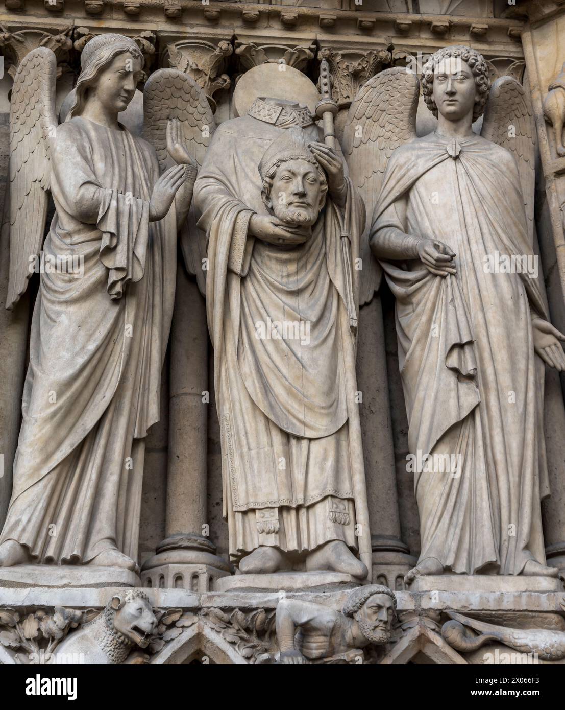Intricate carvings of Catholic saints on the exterior walls of Notre ...