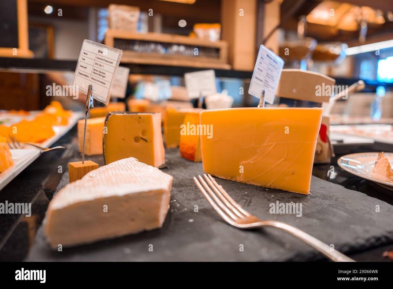 Gourmet Cheese Selection with Brie Label on Slate Board Stock Photo - Alamy
