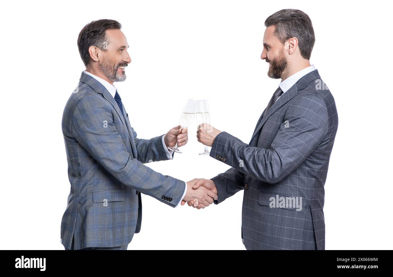 celebrate business deal. two businessmen handshaking after contract ...