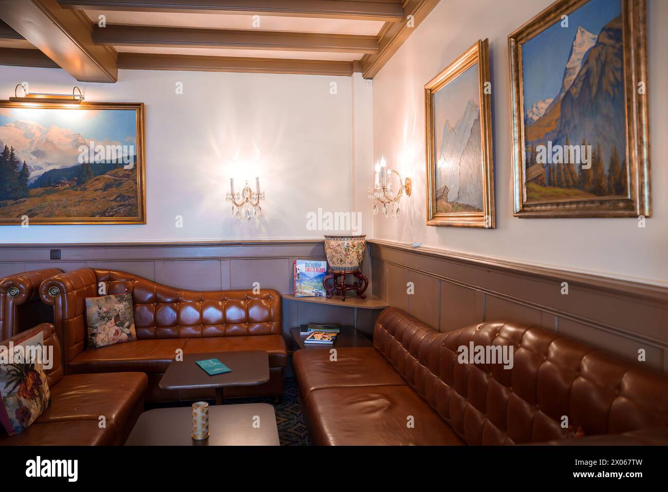 Classic Lounge with Neutral Tones, Mountain Landscape Art, and Leather ...