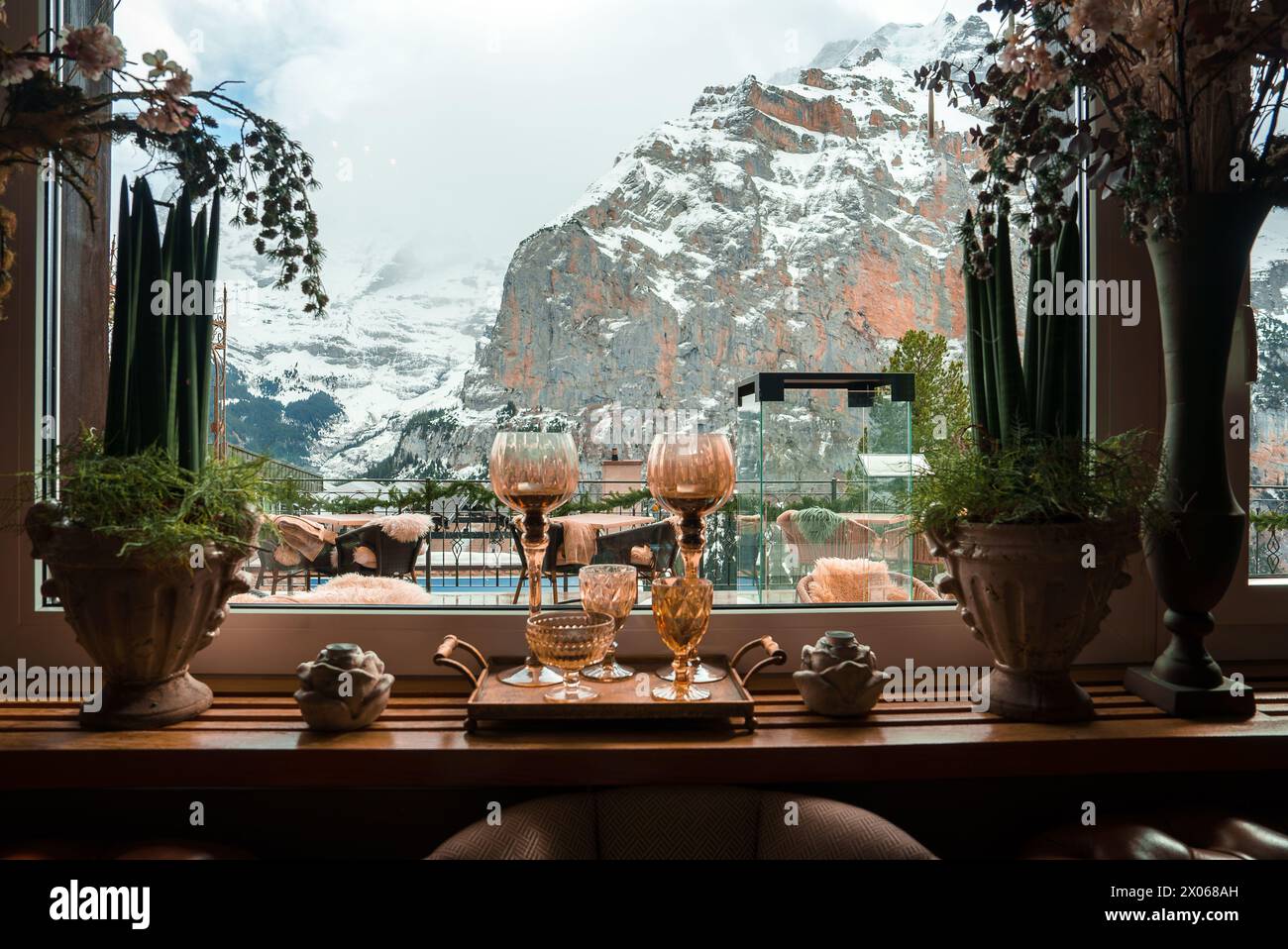 Cozy Interior Scene with Snowy Mountain View through Window Stock Photo ...