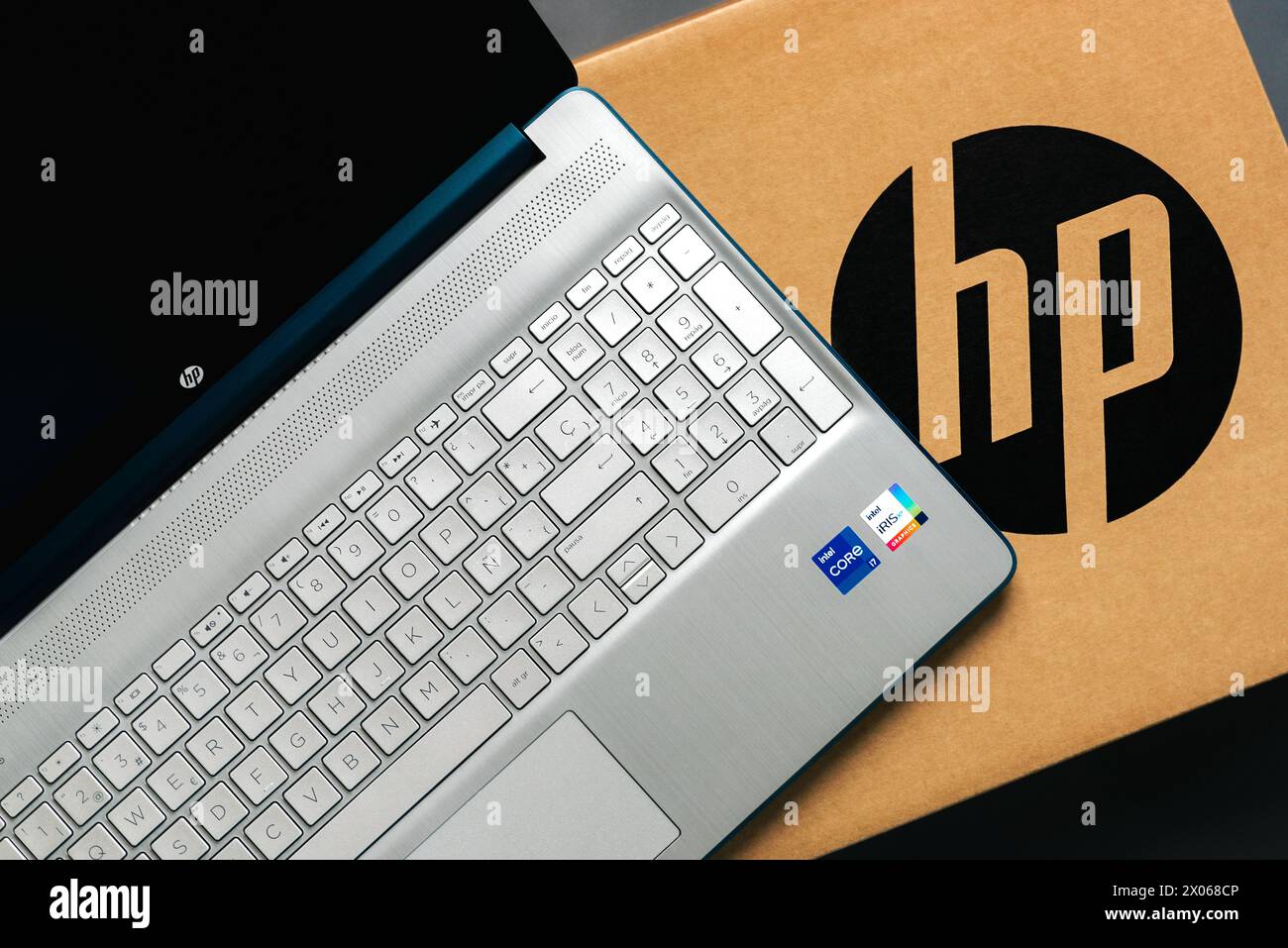 Laptop computer HP on top of the cardboard box with the HP logo over ...