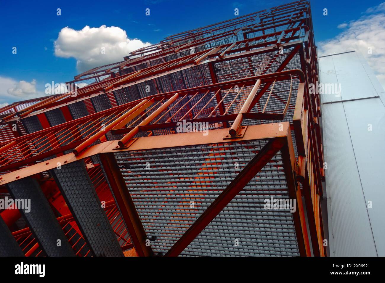 orange stairs of a modern building, low angle view Stock Photo - Alamy