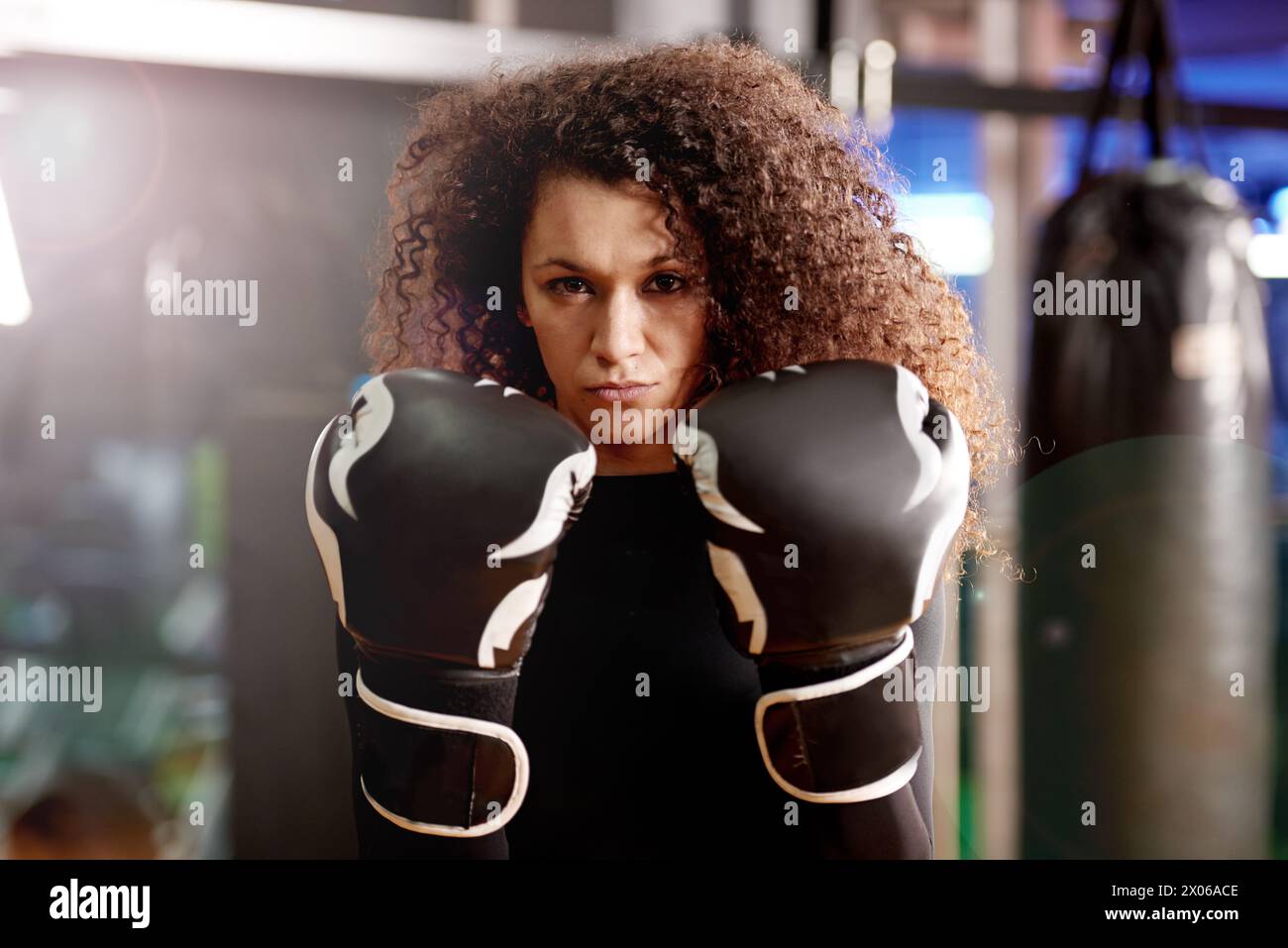 Portrait, serious boxer and woman in gym for exercise, training or ...