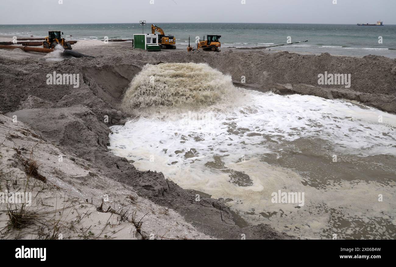 Zingst, Germany. 09th Apr, 2024. A mixture of water and sand is being ...