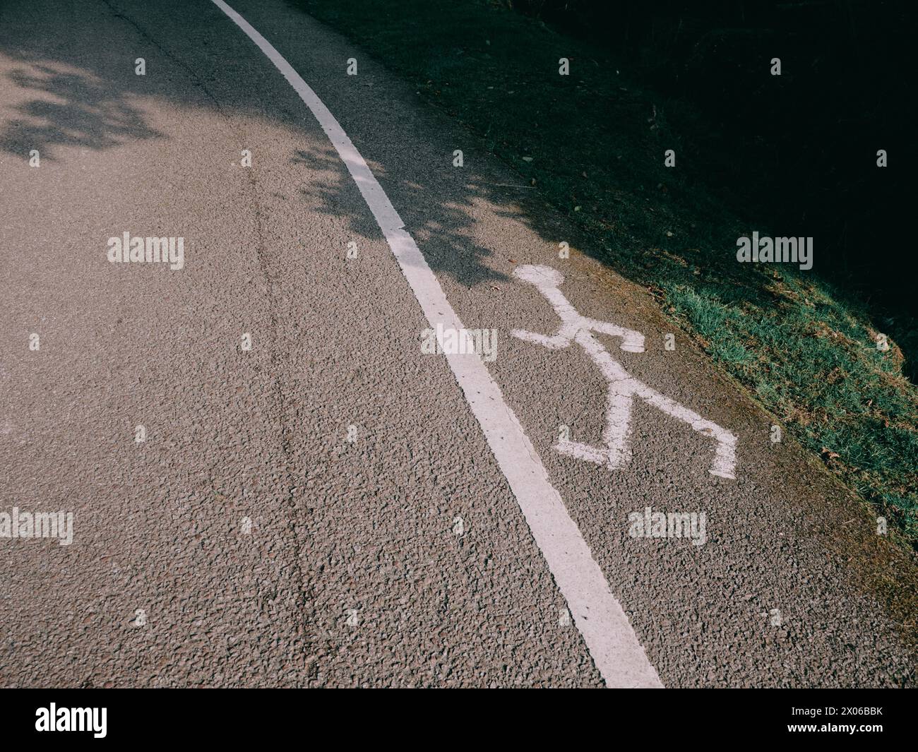 Walk This way - odd hand painted white walking pedestrian figure on a ...