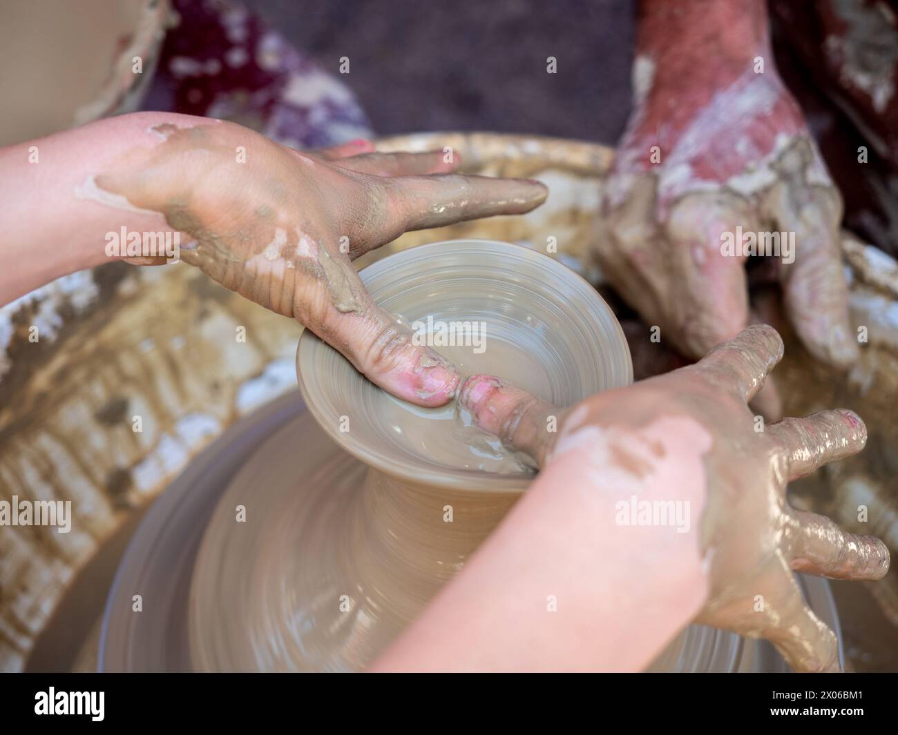 Potter helps girl hands hi-res stock photography and images - Alamy