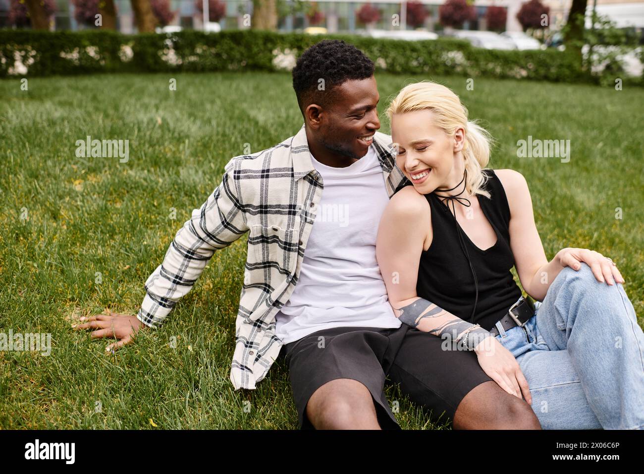 Diverse couple connected embracing hi-res stock photography and images ...