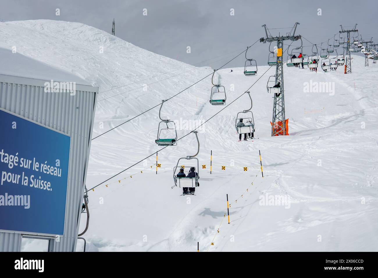 Snowy Mountain Landscape with Operating Ski Lift System in Switzerland ...
