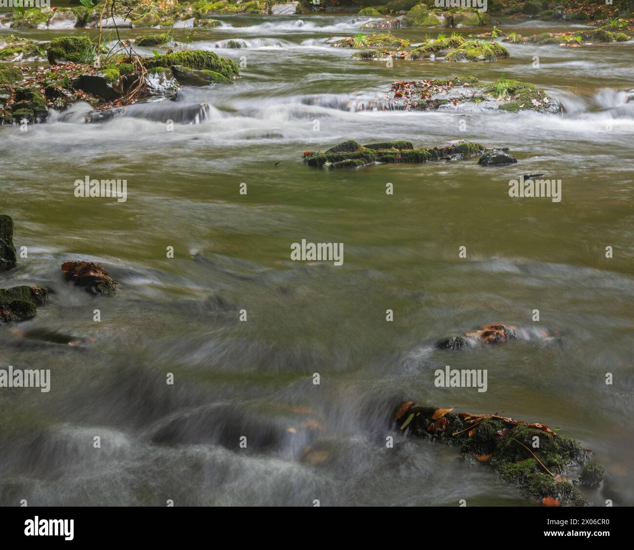 River Barle flowing over the boulders in Shircombe Slade in Exmoor ...