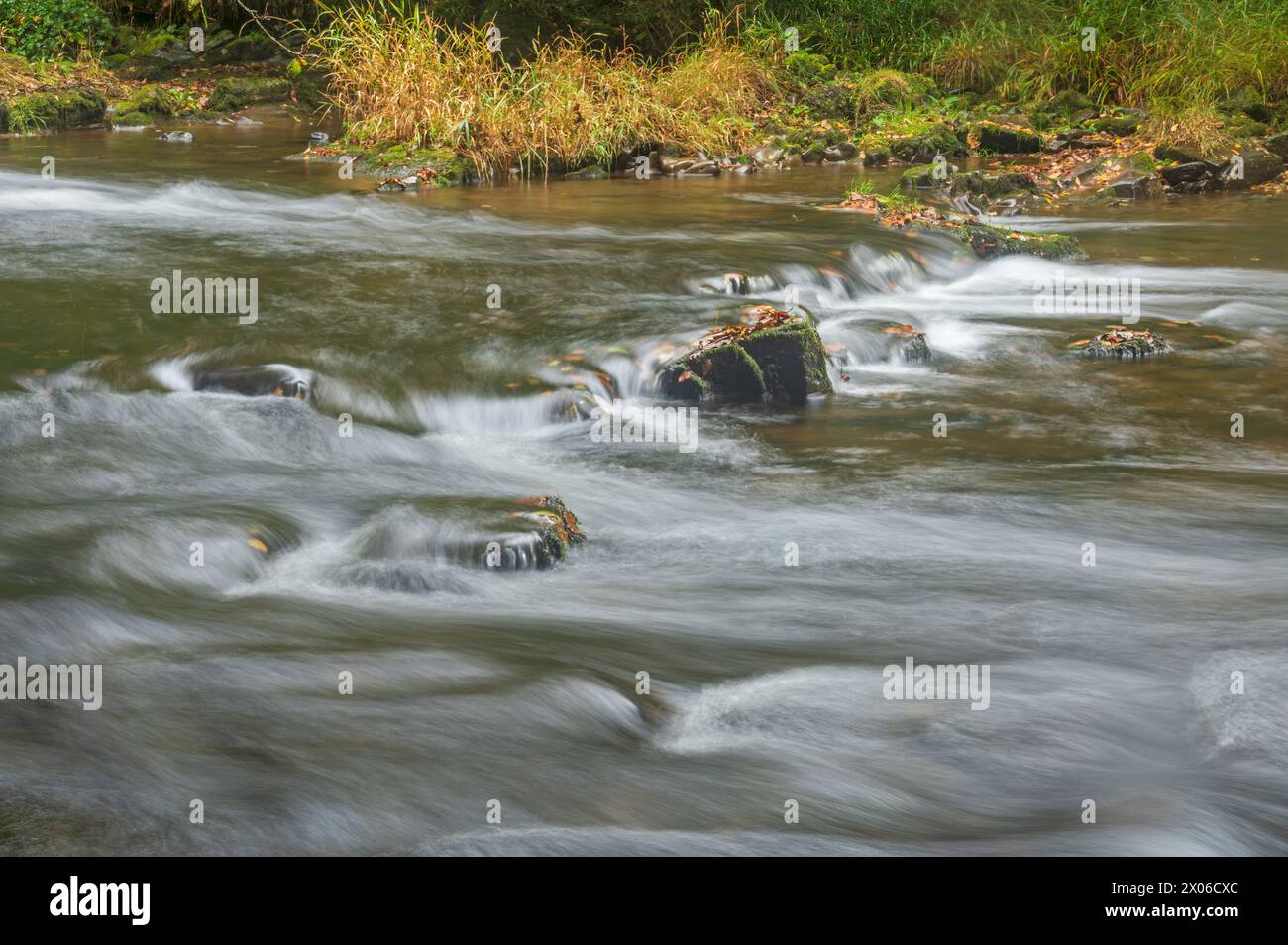River Barle flowing over the boulders in Shircombe Slade in Exmoor ...