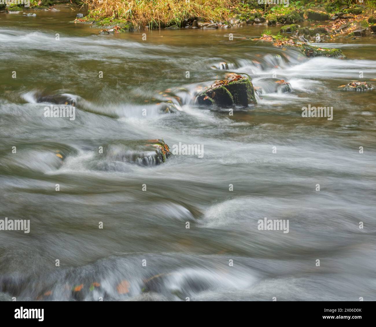 River Barle flowing over the boulders in Shircombe Slade in Exmoor ...