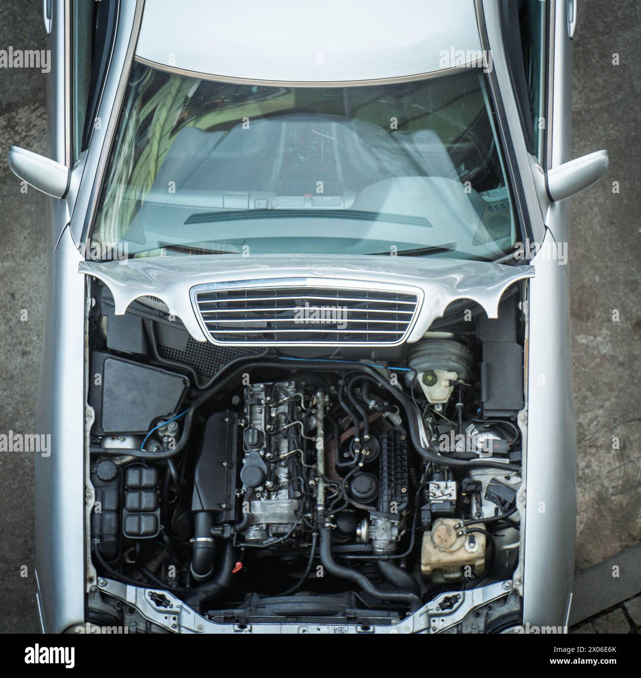 Top view of car engine bay. Motor, mechanical and electrical components ...