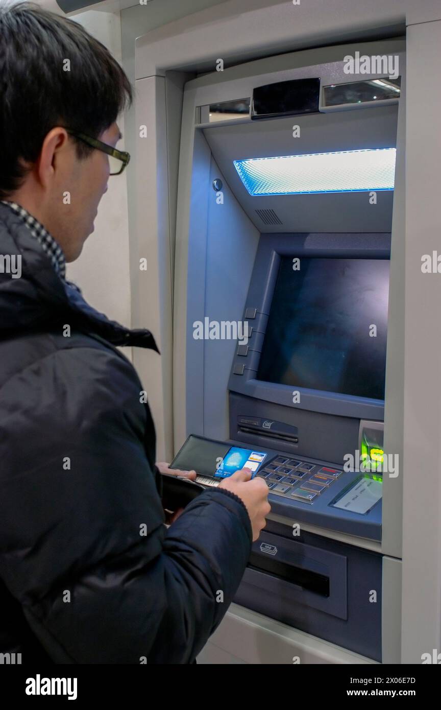 Portrait, Young Asian Man From Behind, Withdrawing Cash From A.T.M ...