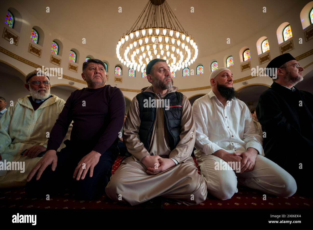 People take part in the Eid al-Fitr prayers in Kyiv, Ukraine, Wednesday ...