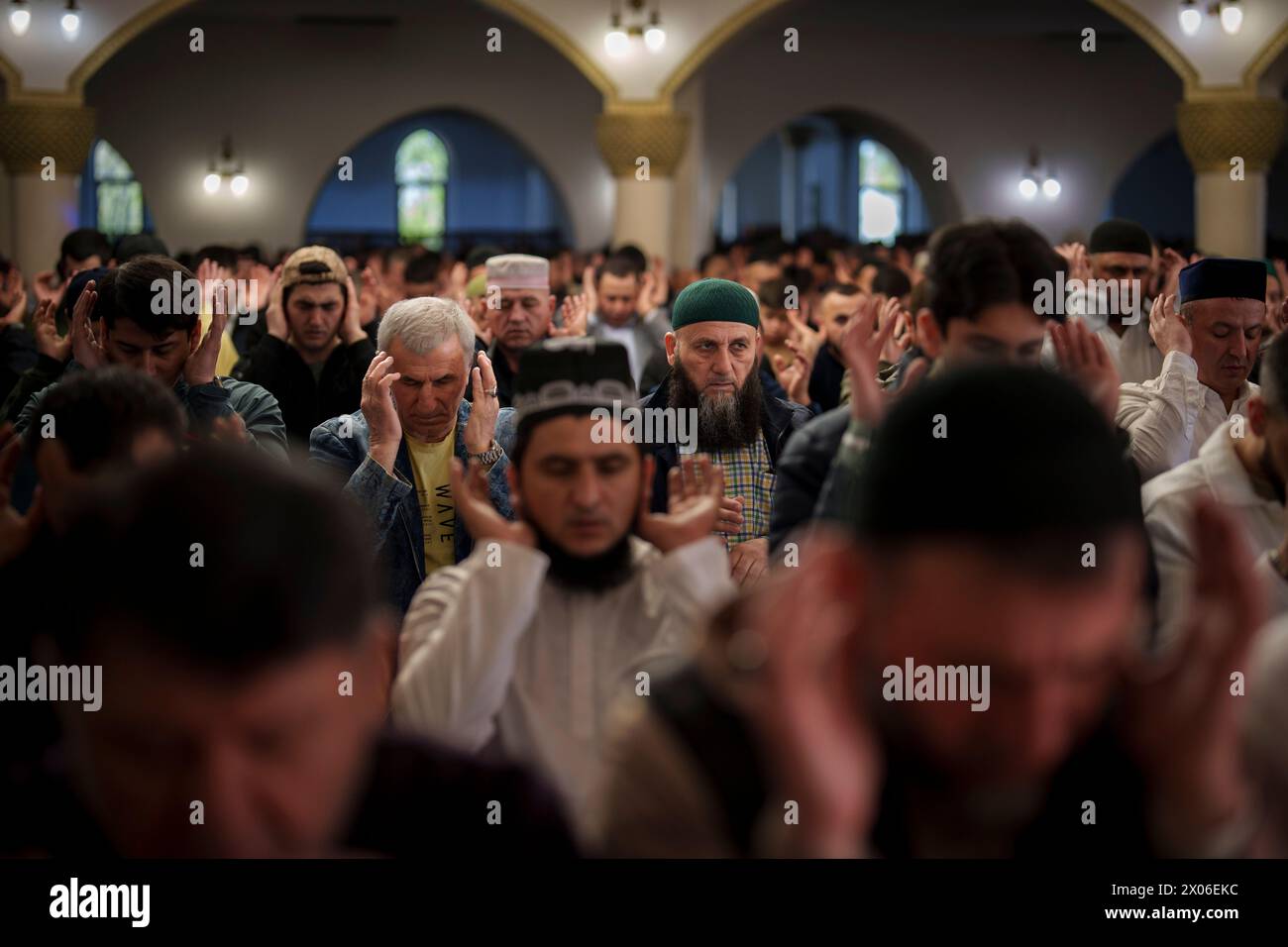 People take part in the Eid al-Fitr prayers in Kyiv, Ukraine, Wednesday ...