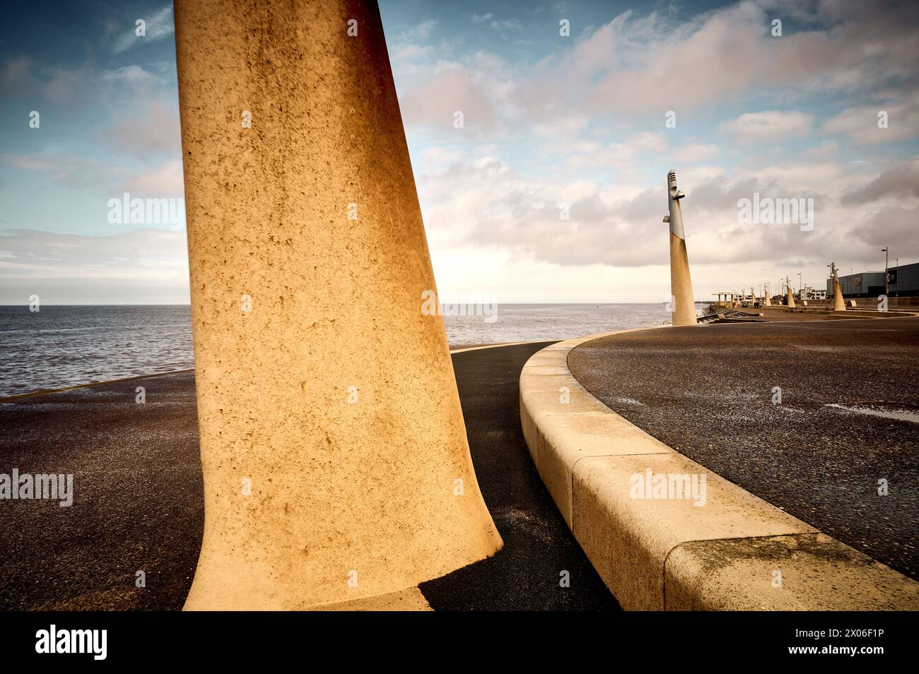 Concrete angled lamp post on Cleveleys seafront Stock Photo - Alamy