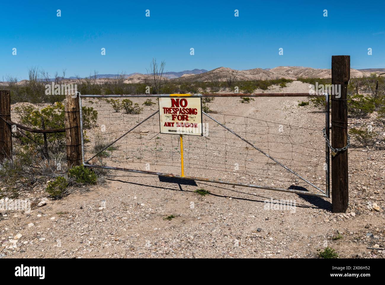 Gate blocking dirt road leading to Chinati Mtns State Natural Area ...