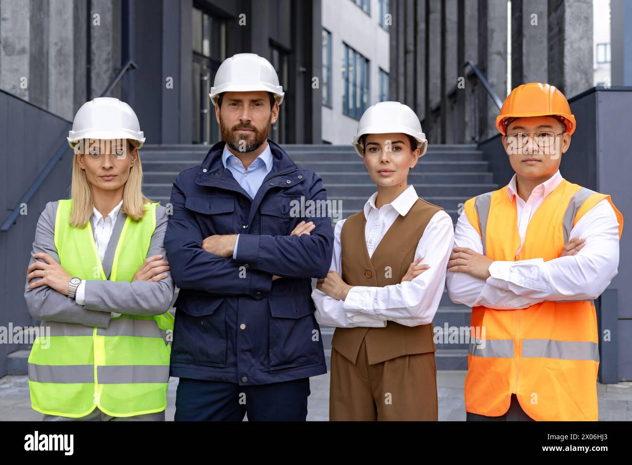 Group engineers examining blueprint hi-res stock photography and images ...