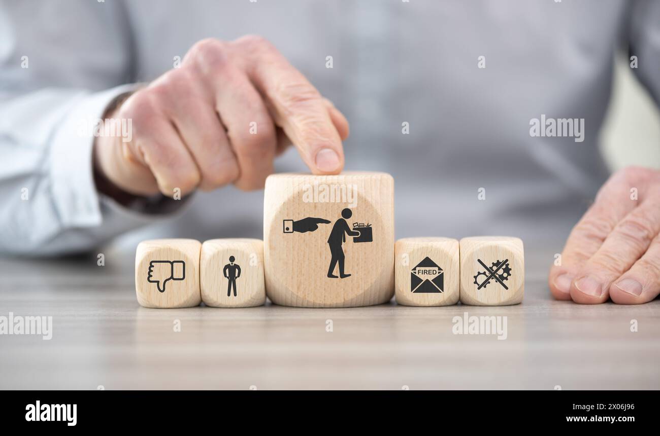 Wooden blocks with symbol of job loss concept Stock Photo - Alamy