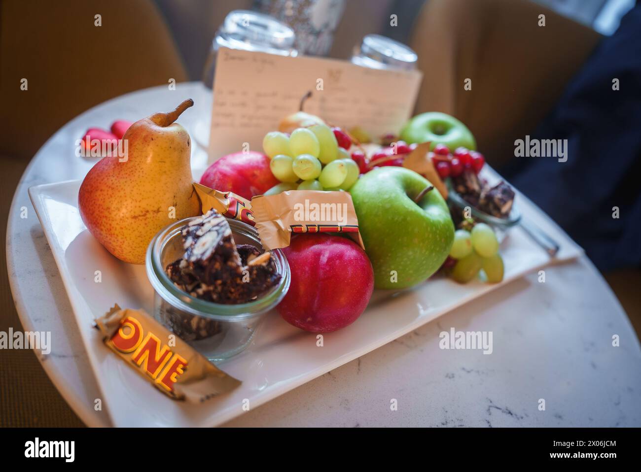 Luxury hotel fruit platter on white marble table, Zermatt Stock Photo ...
