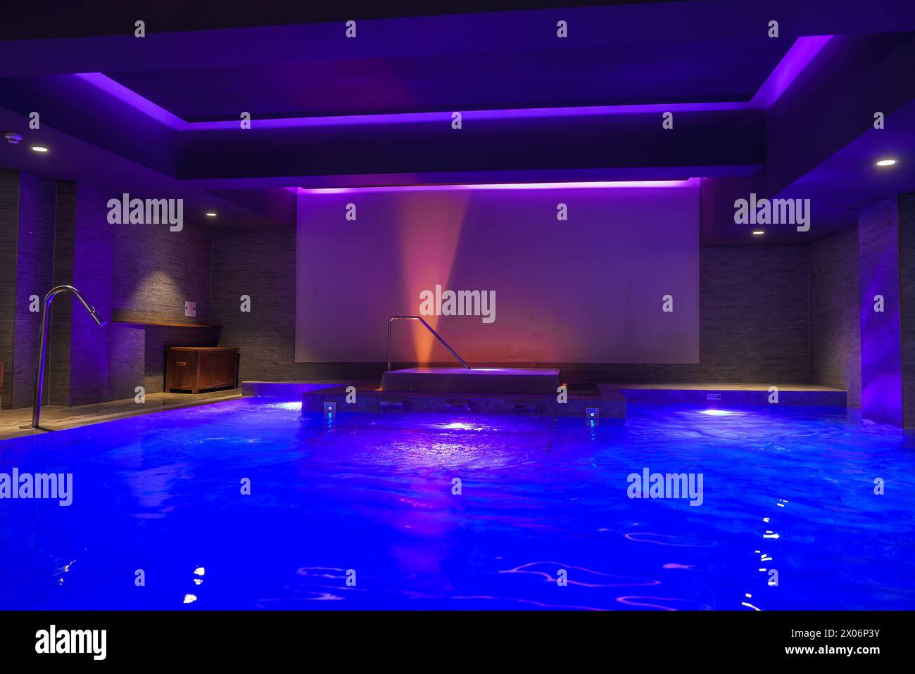 Luxury Indoor Swimming Pool with Vibrant Blue Lighting in Zermatt Hotel ...