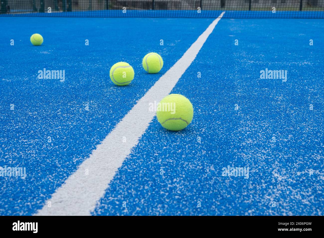Paddle tennis balls on a paddle tennis court for background Stock Photo ...
