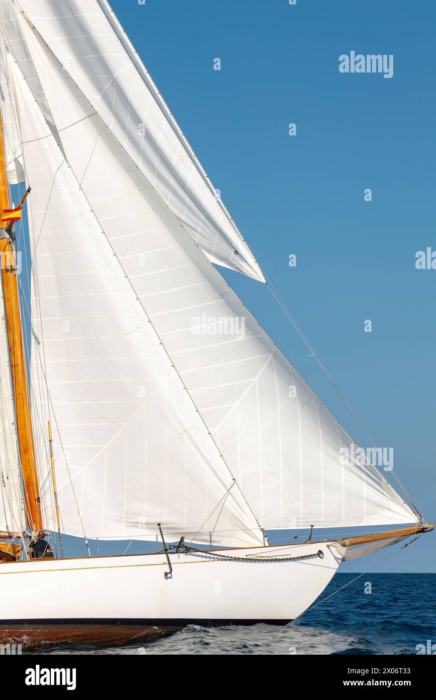 White Dacron sails on a classic wooden sail boat with wooden masts ...
