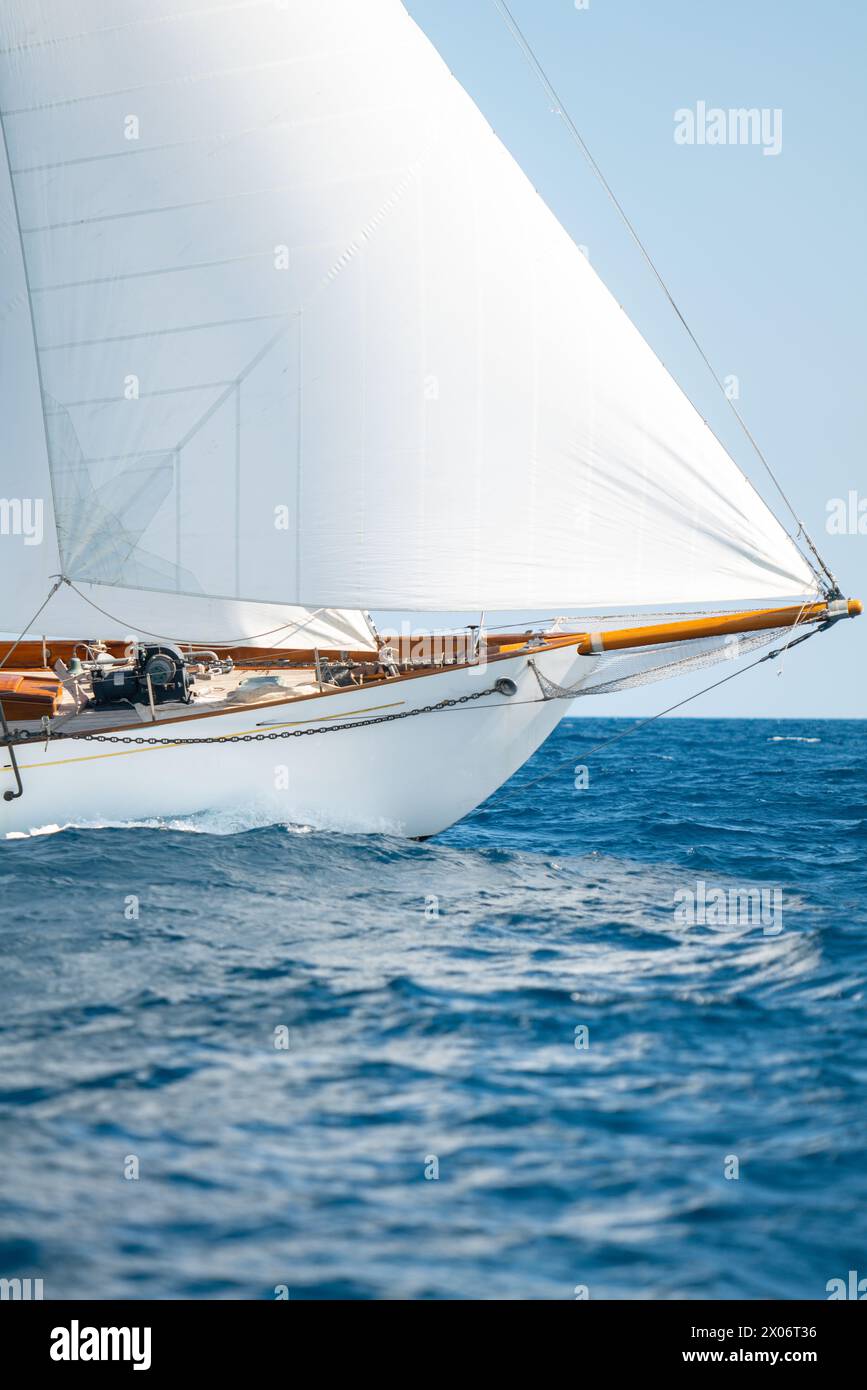 White Dacron sails on a classic wooden sail boat with wooden masts ...