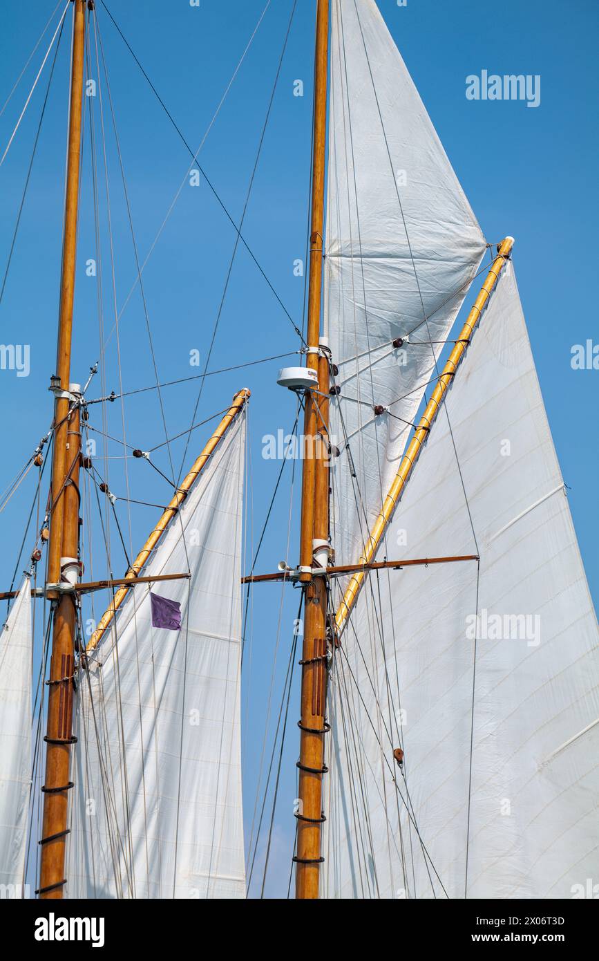 White Dacron sails on a classic wooden sail boat with wooden masts ...