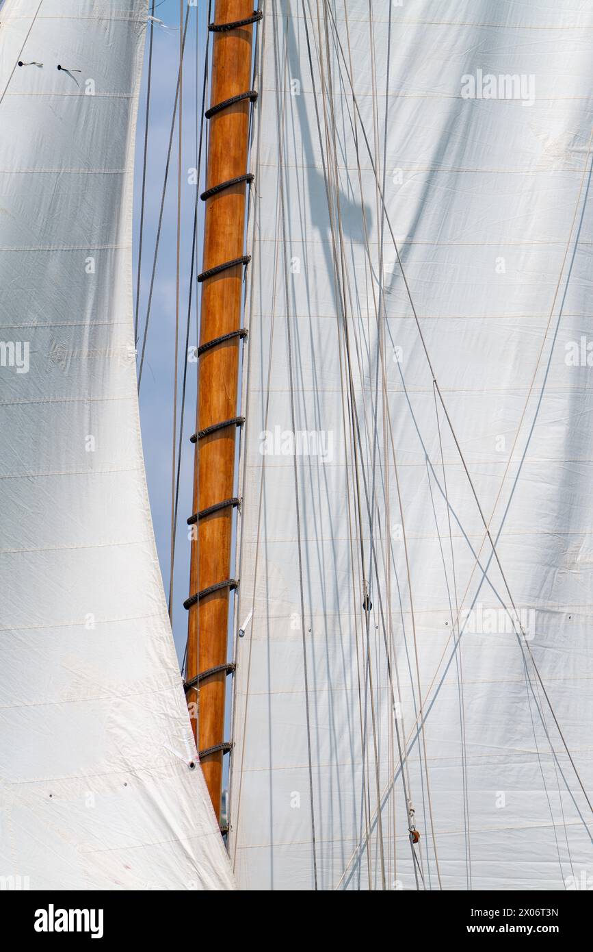 White Dacron sails on a classic wooden sail boat with wooden masts ...