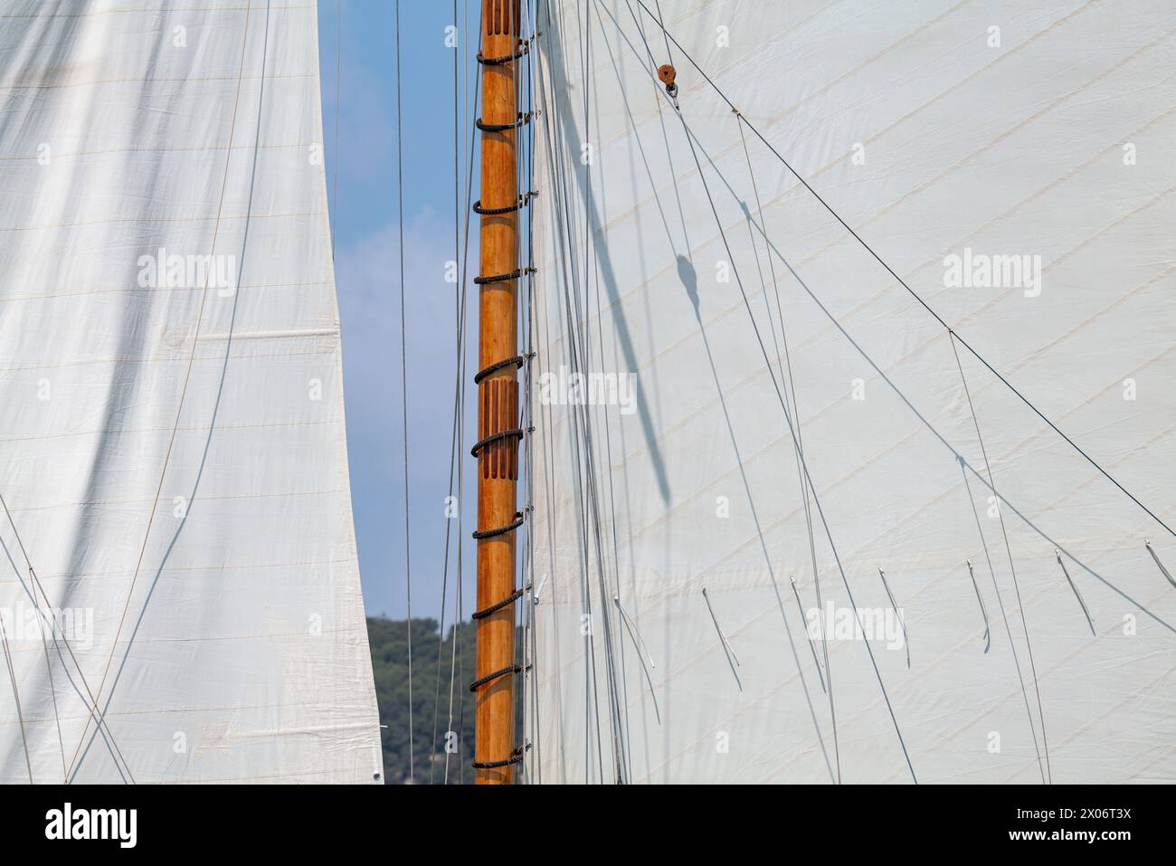 White Dacron sails on a classic wooden sail boat with wooden masts ...