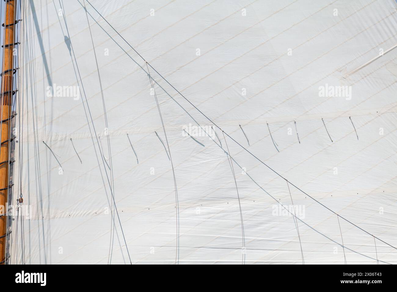 White Dacron sails on a classic wooden sail boat with wooden masts ...