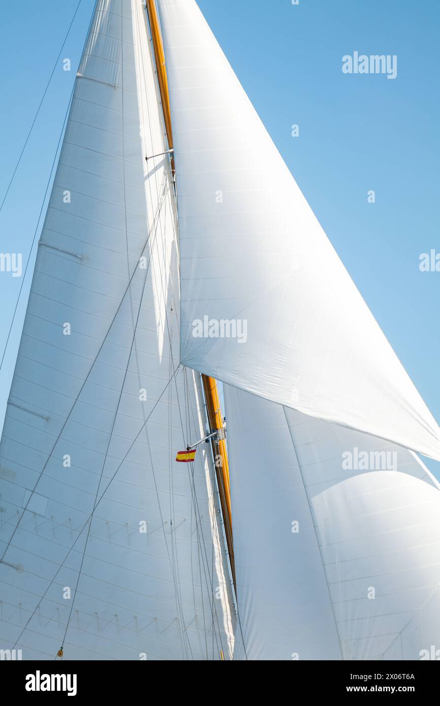 White Dacron sails on a classic wooden sail boat with wooden masts ...