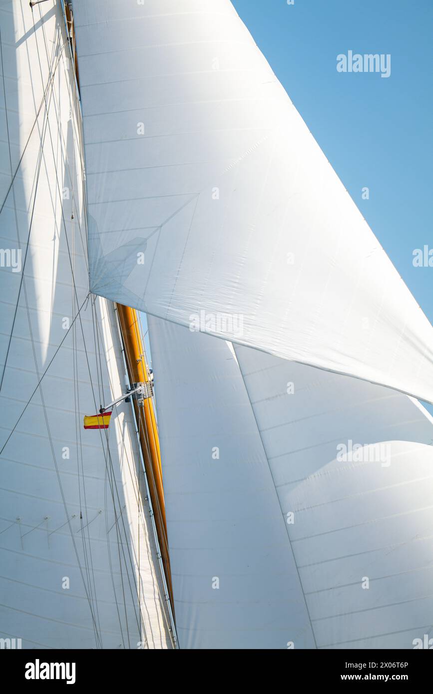 White Dacron sails on a classic wooden sail boat with wooden masts ...