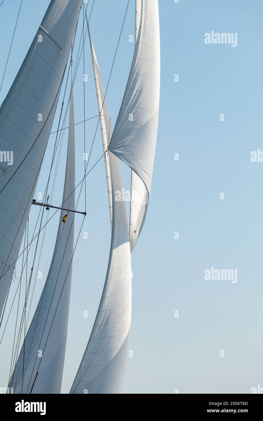 White Dacron sails on a classic wooden sail boat with wooden masts ...