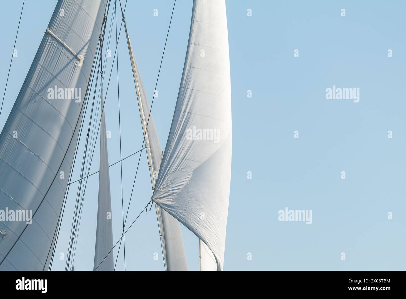 White Dacron sails on a classic wooden sail boat with wooden masts ...