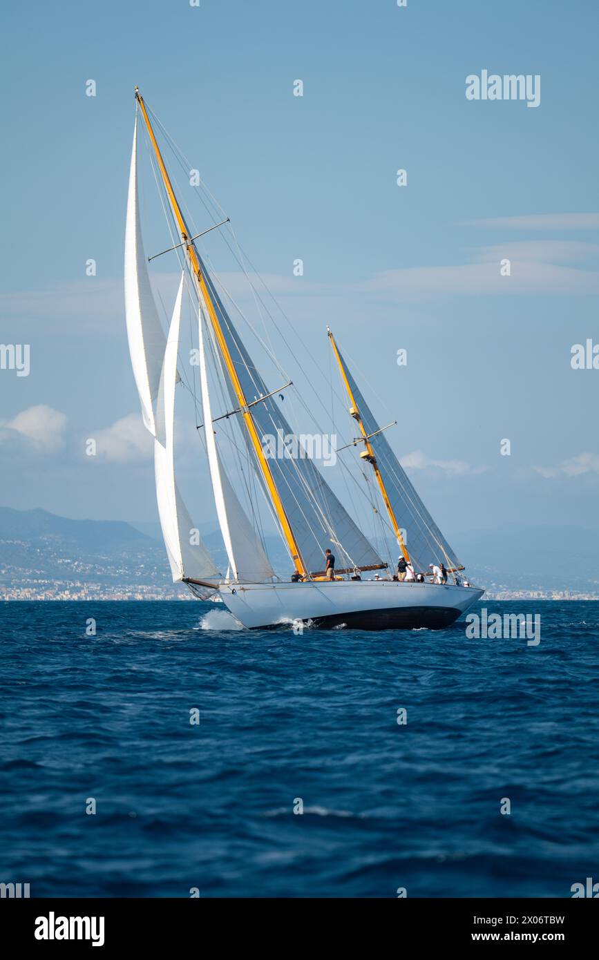 White Dacron sails on a classic wooden sail boat with wooden masts ...