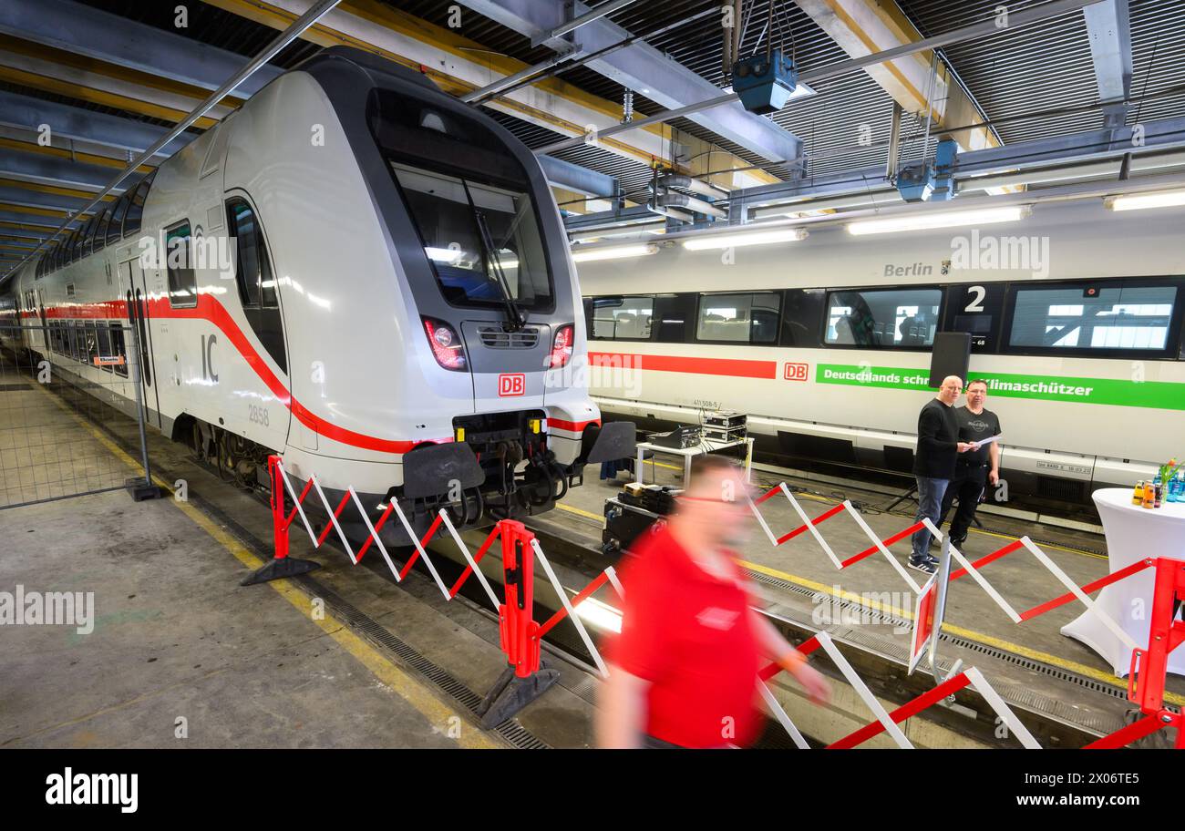 Hanover, Germany. 10th Apr, 2024. A Deutsche Bahn employee walks next ...