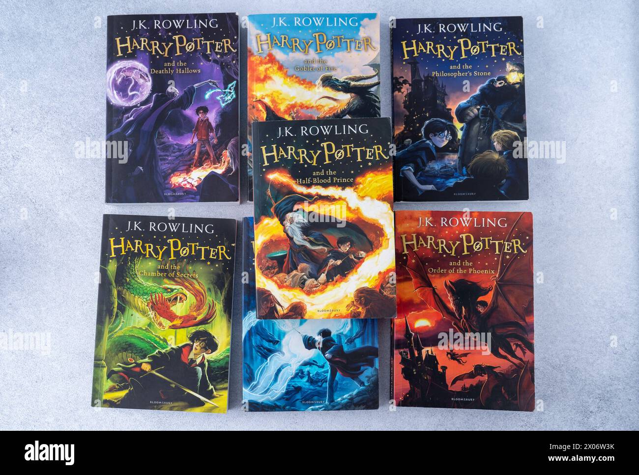 A stack of books about Harry Potter by writer JK Rowling. Collection ...