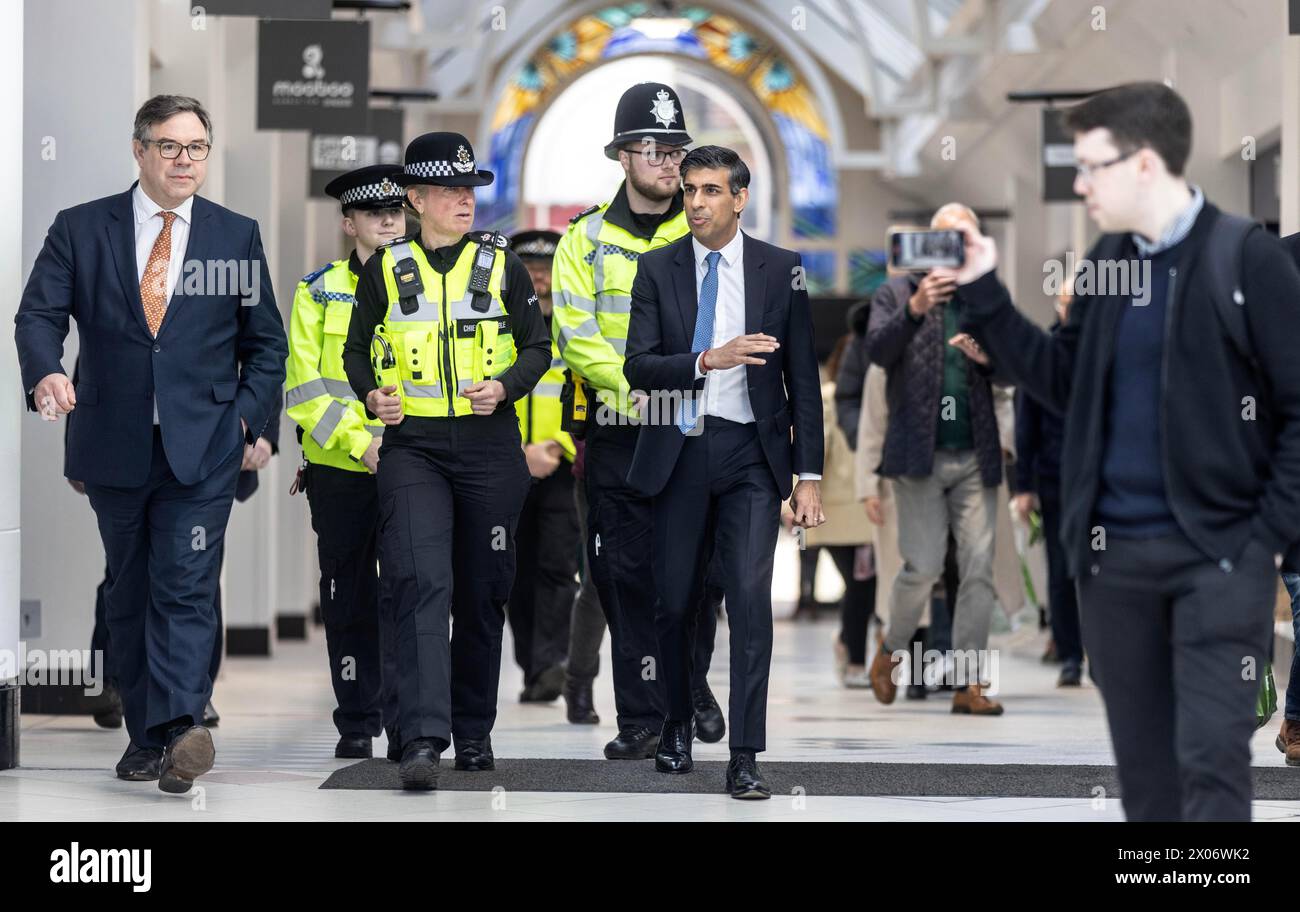 Prime Minister Rishi Sunak (centre) walks through Swan Walk shopping ...
